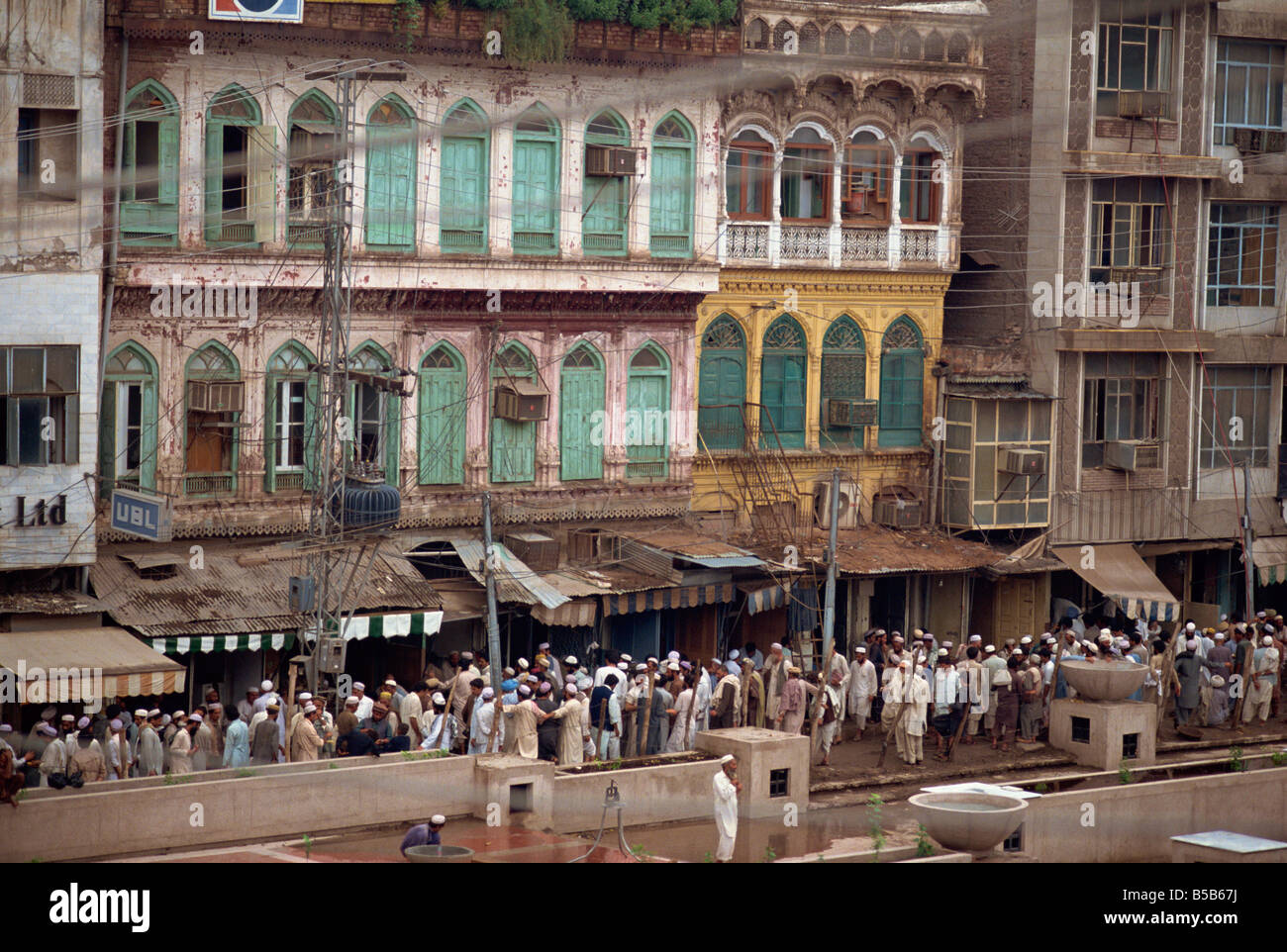 Crowds on men on a street in the old town of Peshawar Pakistan Asia D C ...