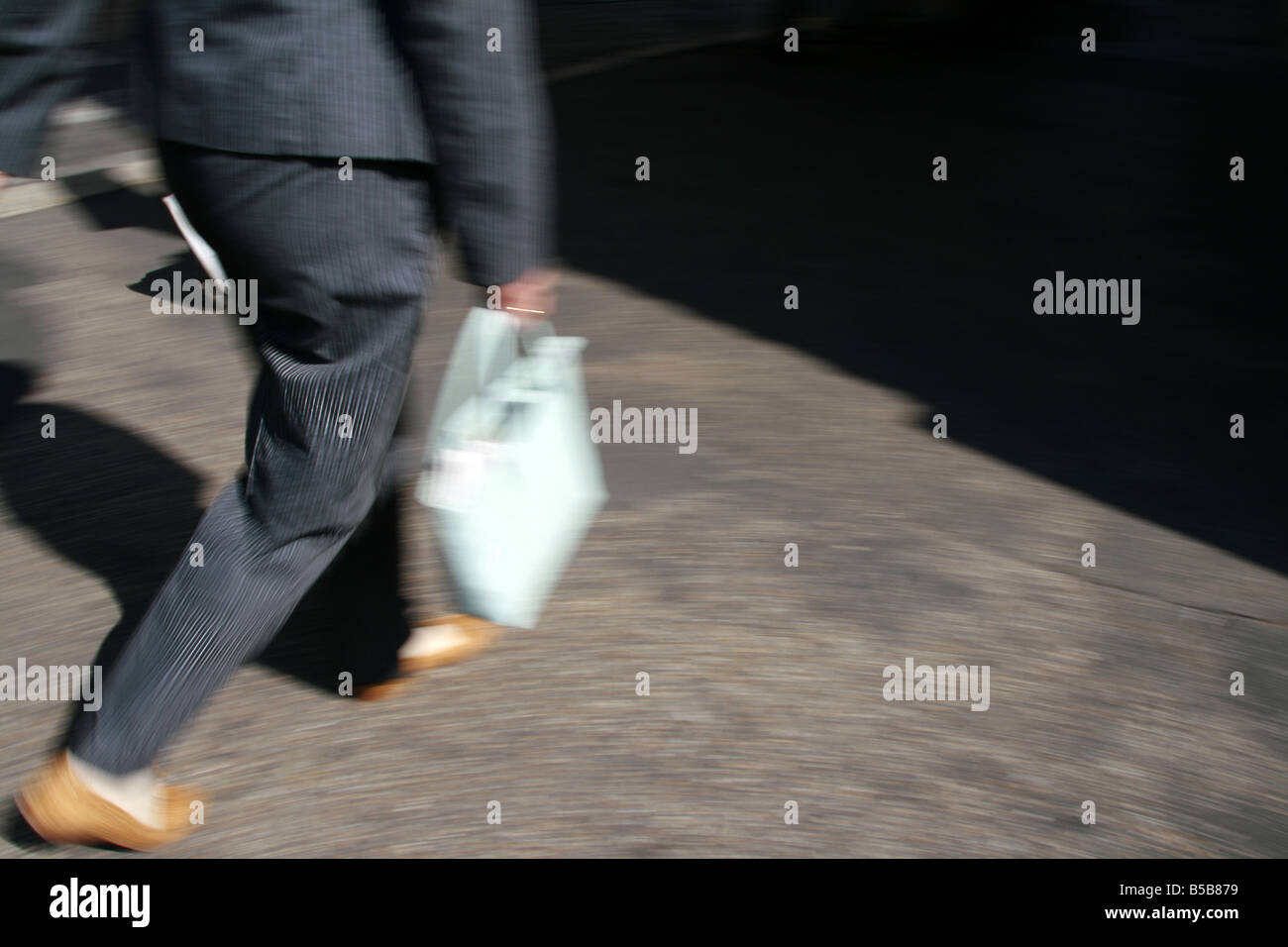 one person walking in street in city town Stock Photo - Alamy