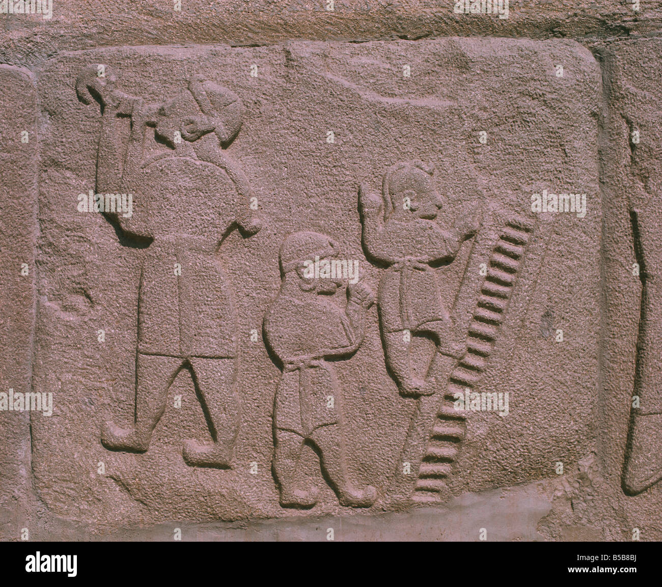Copy at archaeological sites of Hittite relief showing sword swallowers ...