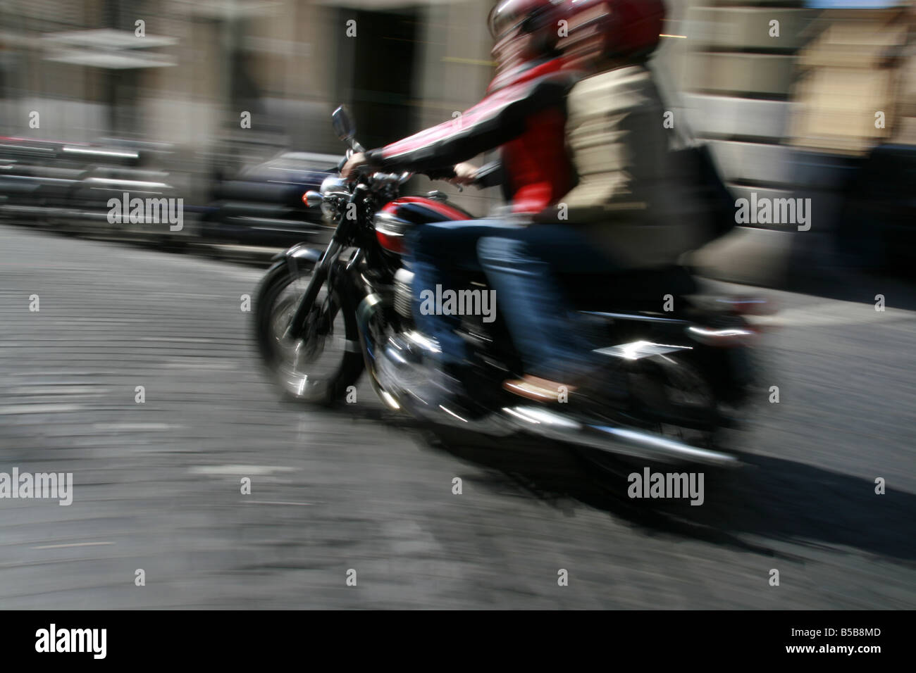 two people riding scooter moped in rome italy Stock Photo - Alamy