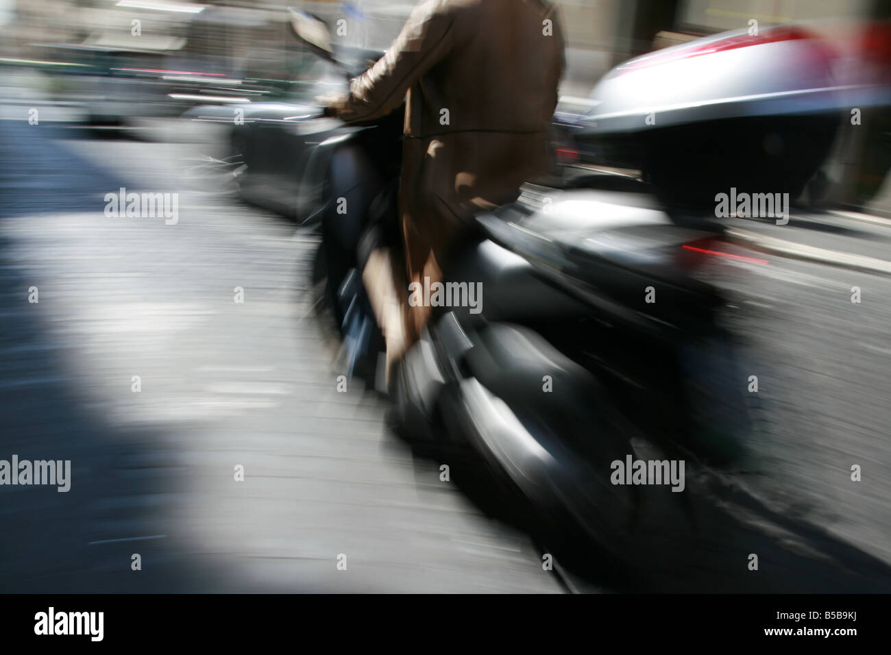 person riding scooter moped in rome italy Stock Photo - Alamy