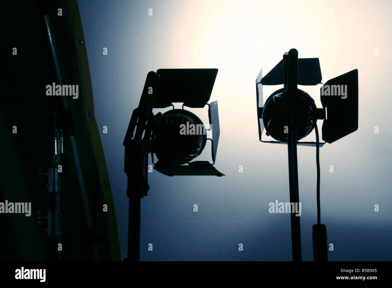 two tv film lights on set outdoors at night Stock Photo - Alamy