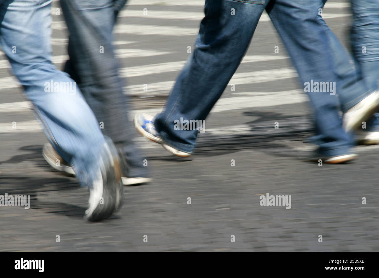 group young people in denim jeans walking in town Stock Photo - Alamy