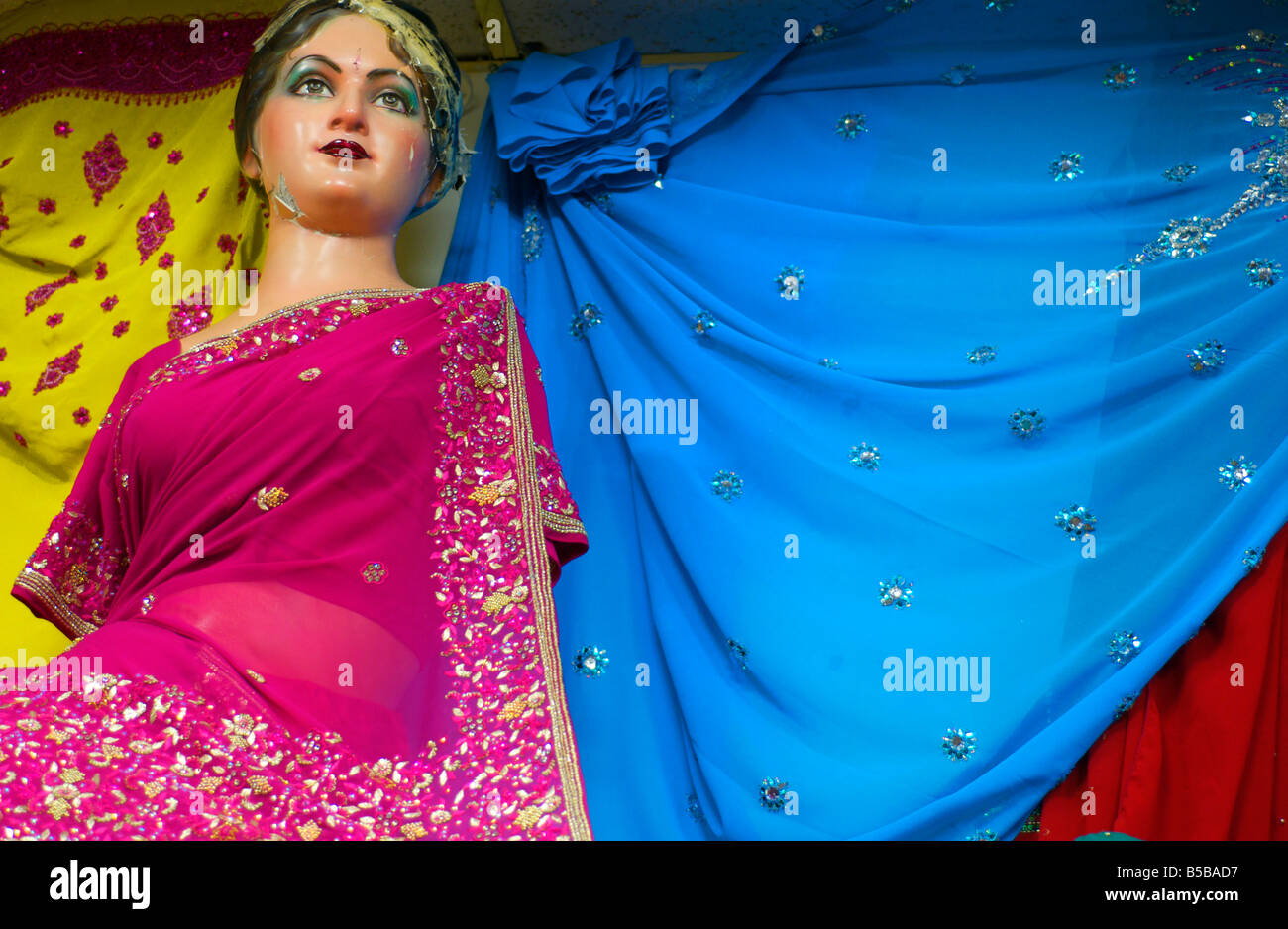 A fashion dummy with sari fabrics draped around Stock Photo - Alamy