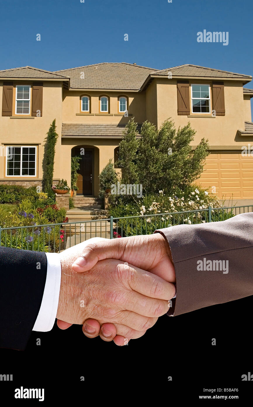 Businessman handshake against the construction of new homes Stock Photo ...