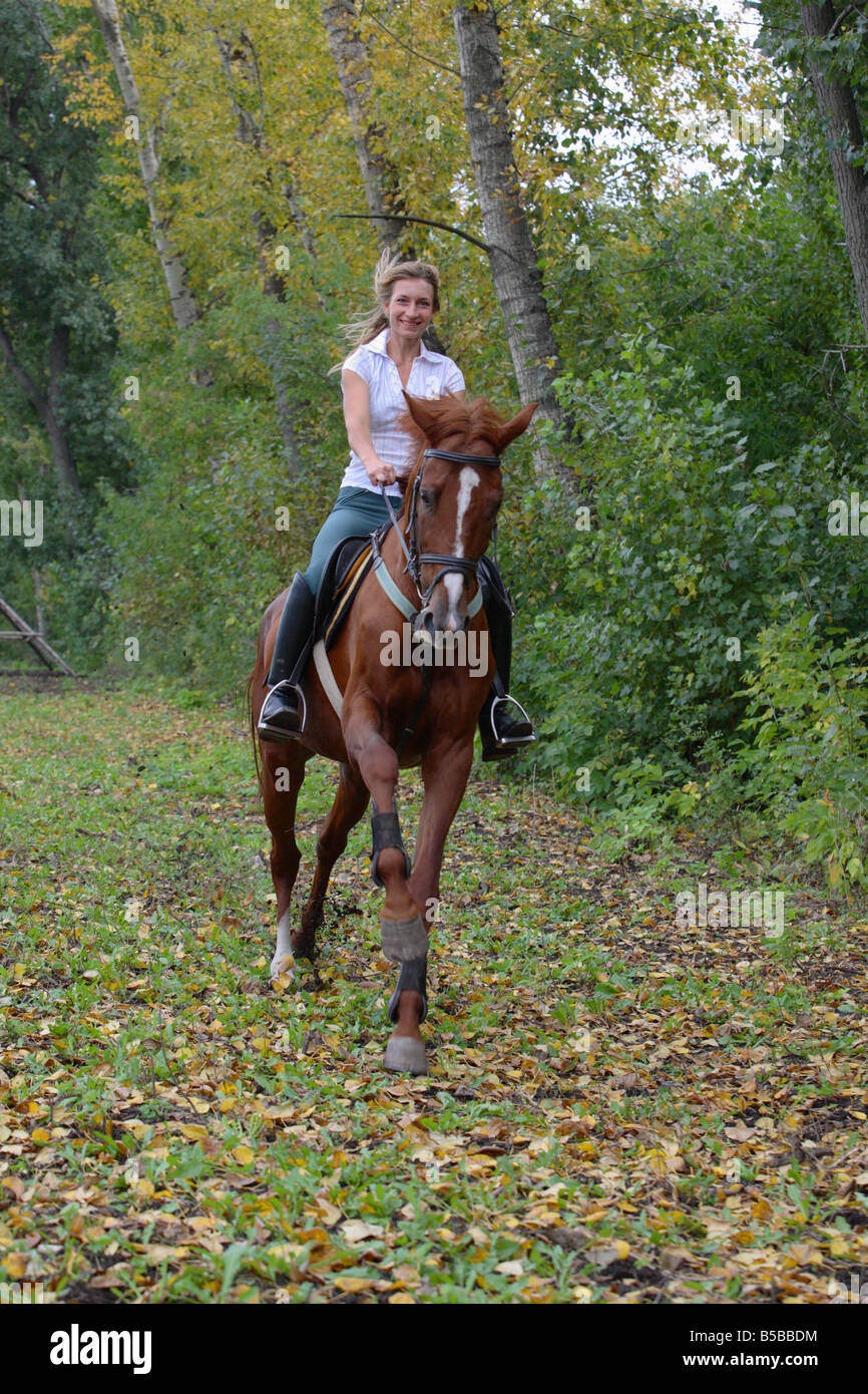 Woman riding a horse Stock Photo - Alamy