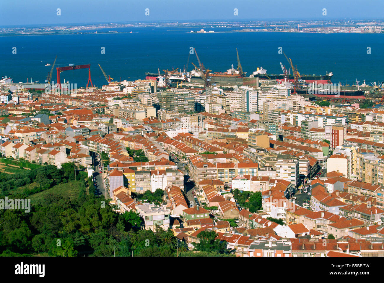 Low aerial view Miradouro Santa Luzia above the Hill of Alfama ...