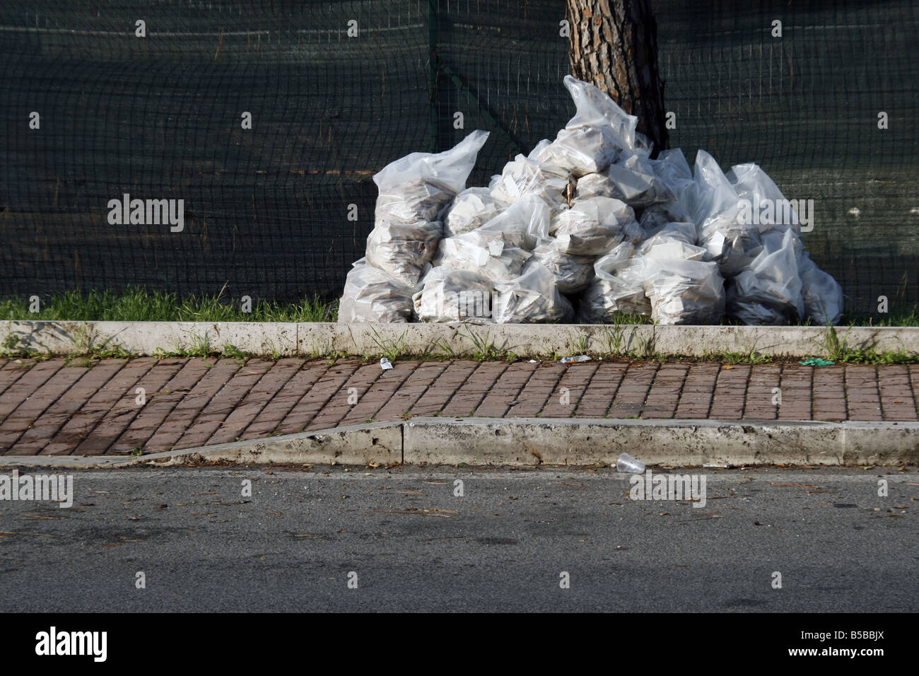 plastic sacks full of rubble from building site dumped in street Stock ...