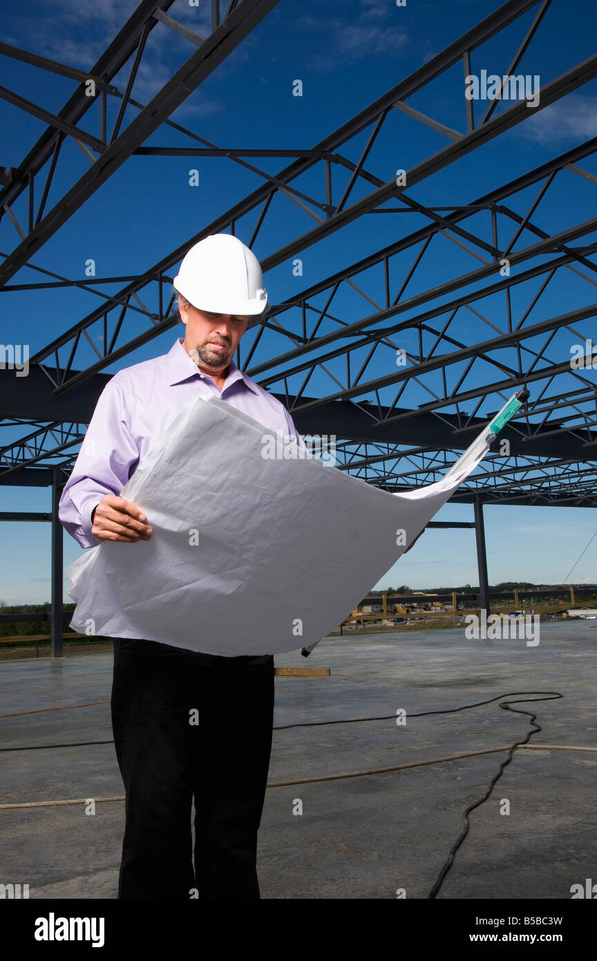 Architect with blueprints Stock Photo - Alamy