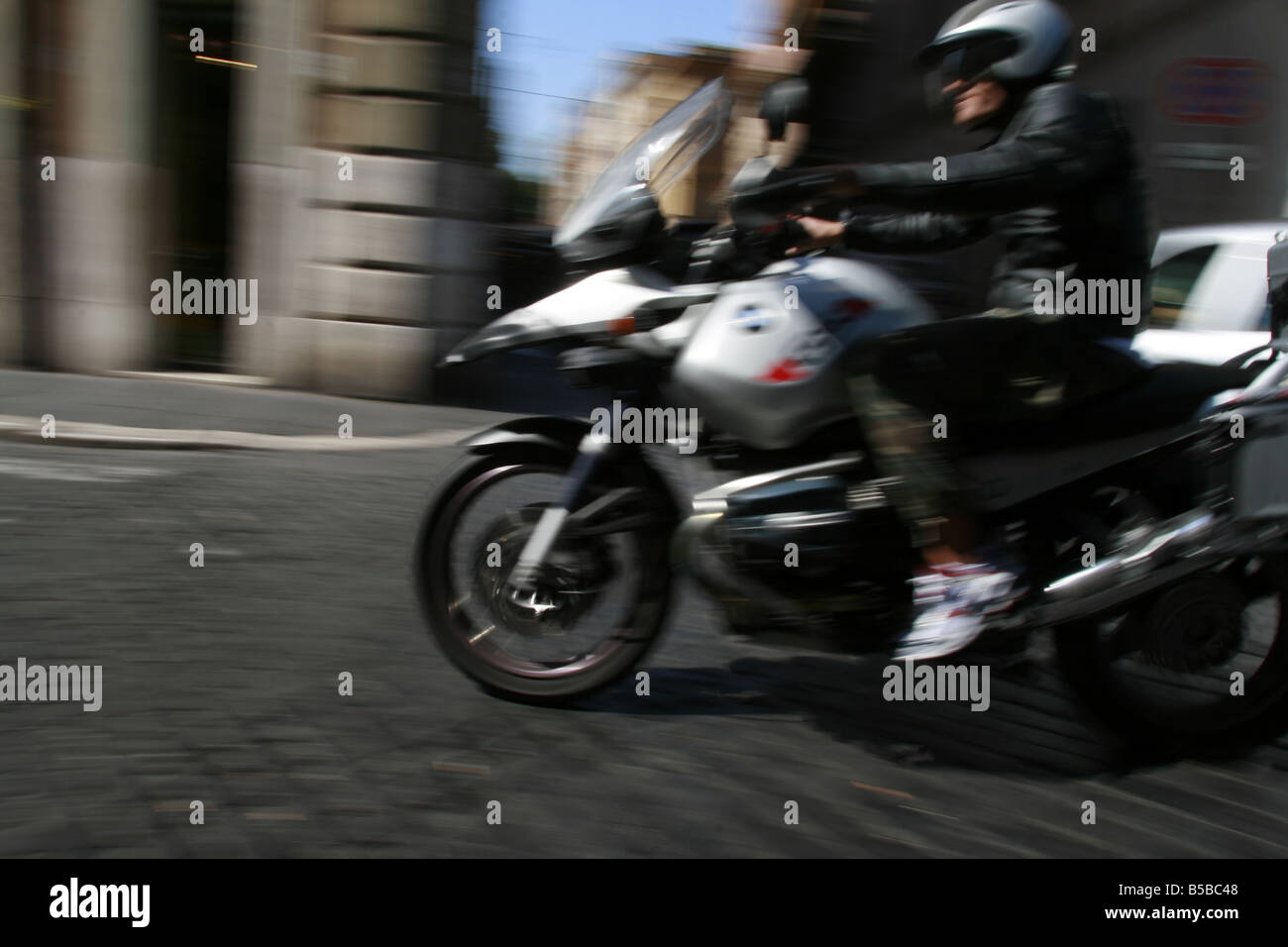Riding scooter moped in rome hi-res stock photography and images - Alamy