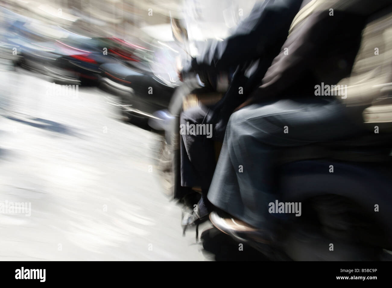 two people riding scooter moped in rome italy Stock Photo - Alamy