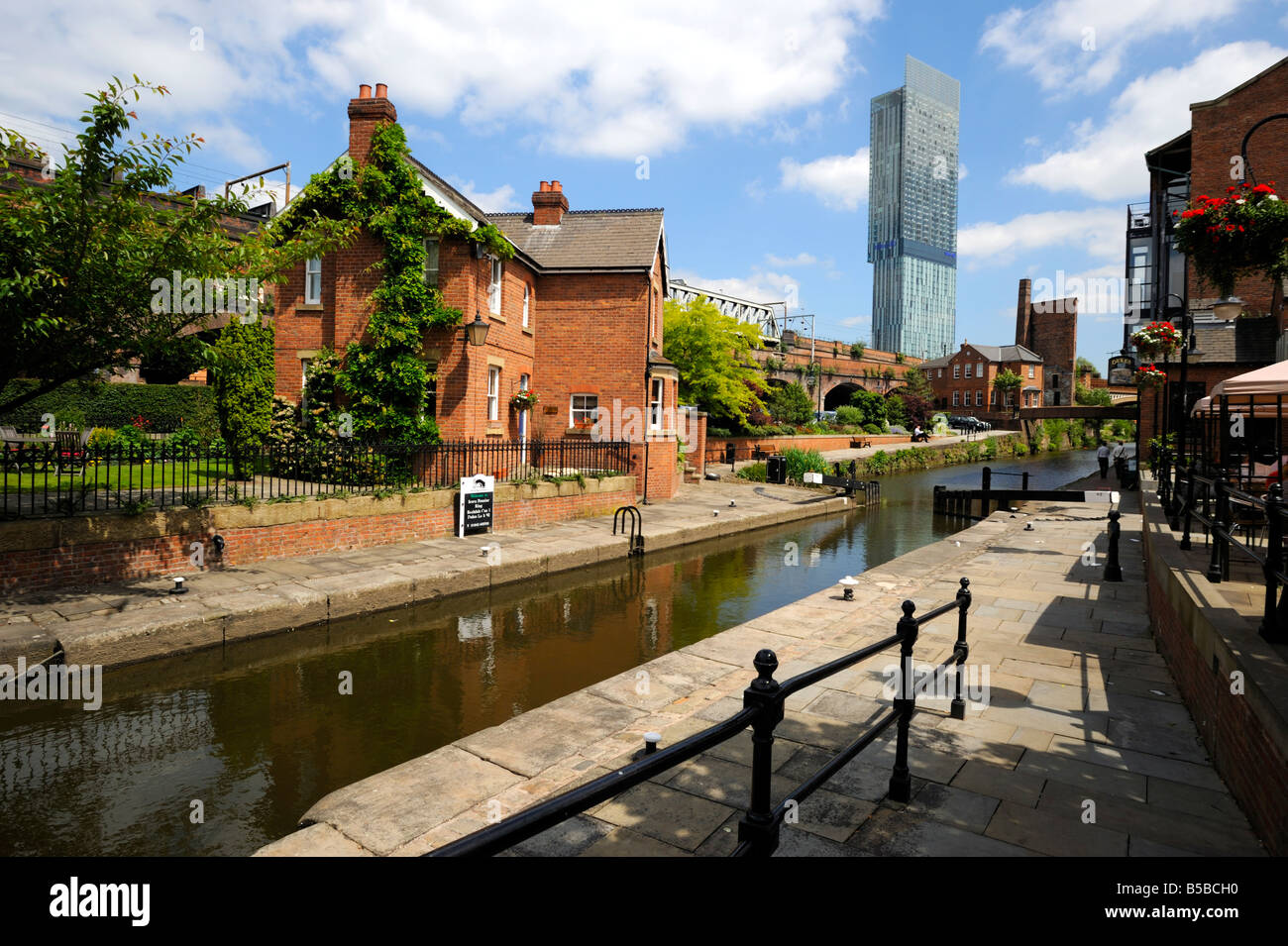 Canal and lock keepers cottage at Castlefield with the Beetham Tower in ...
