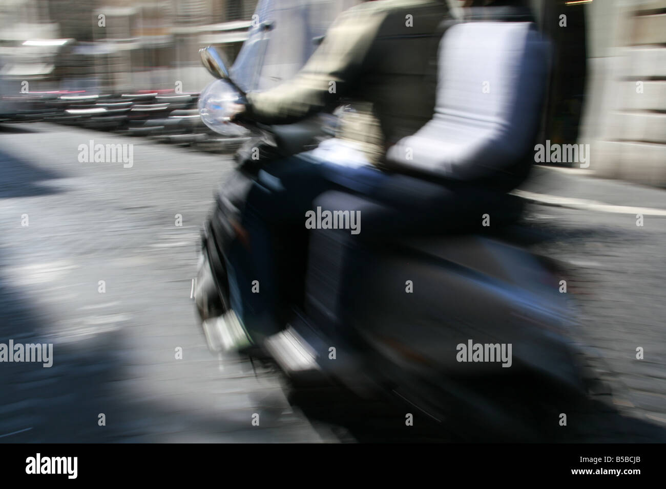 two people riding scooter moped in rome italy Stock Photo - Alamy