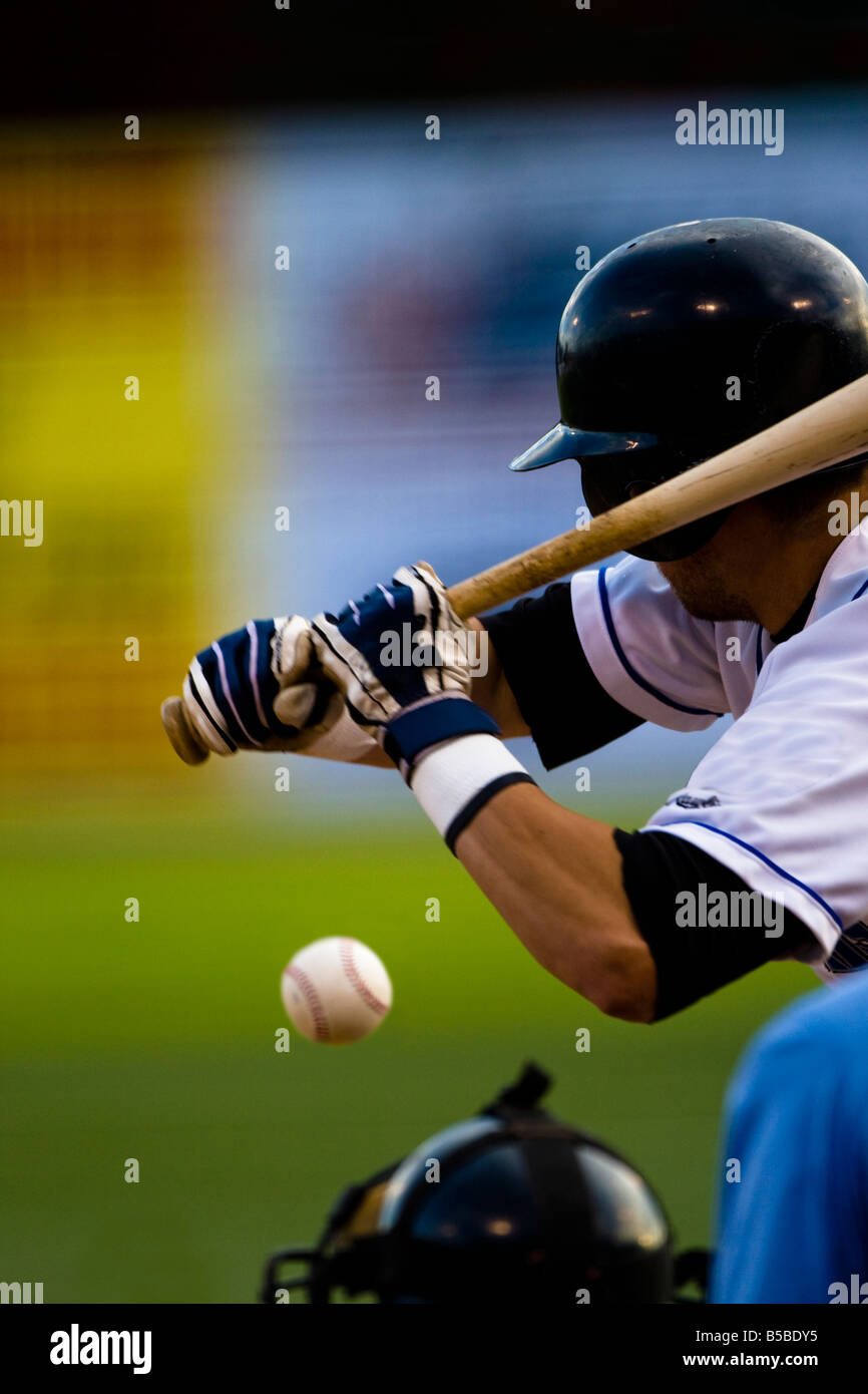 Man playing baseball Stock Photo - Alamy