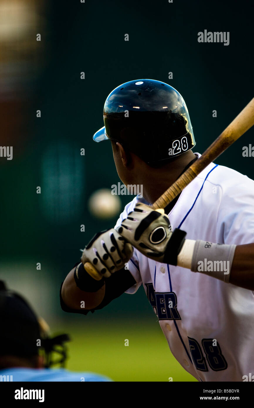 Man playing baseball Stock Photo - Alamy