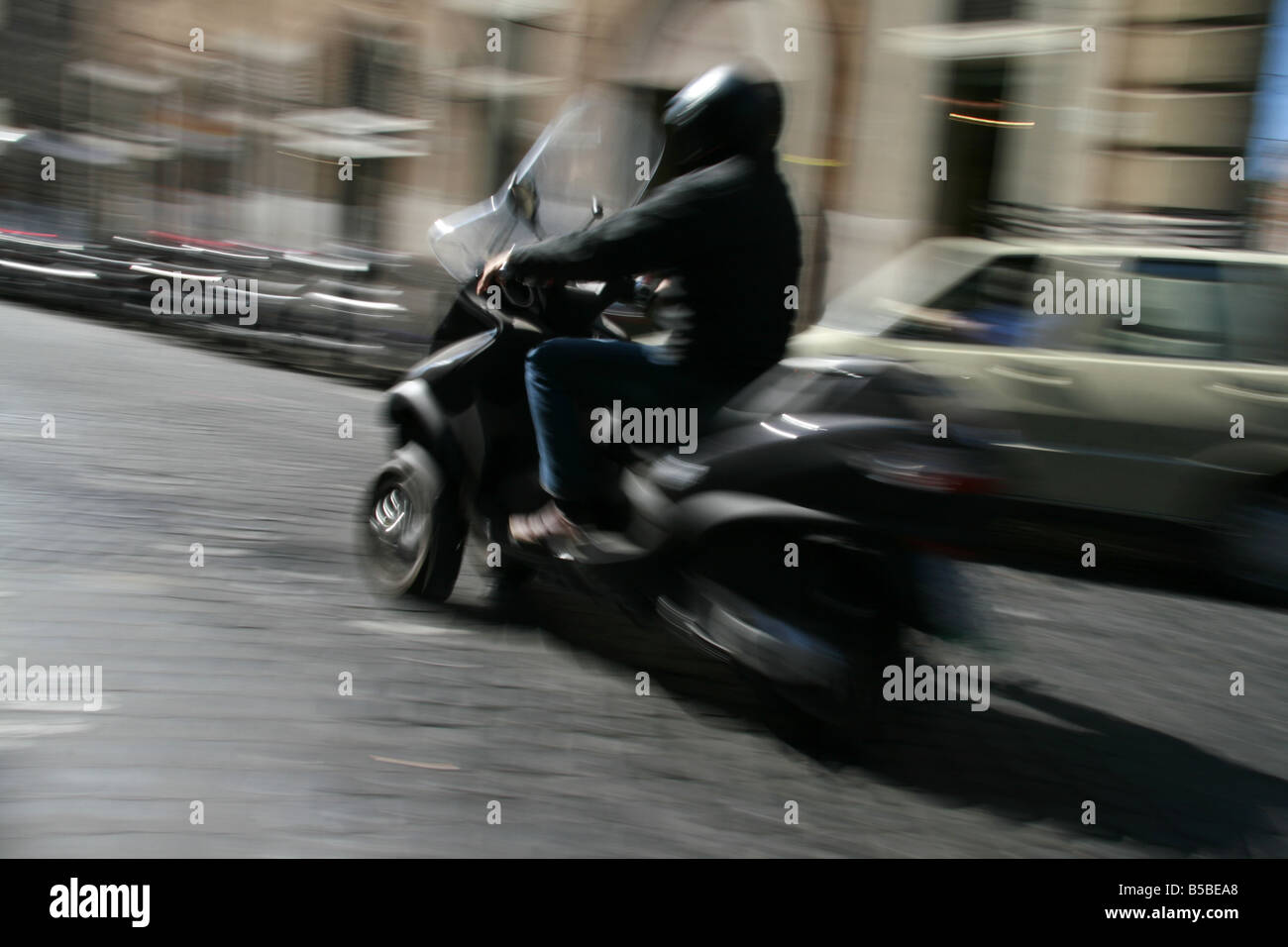person riding scooter moped in rome italy Stock Photo - Alamy