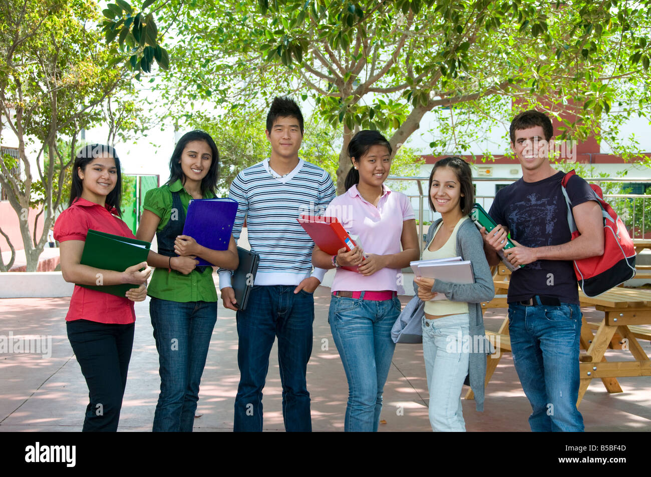 Multicultural Teenagers School group outdoors smiling senior teens ...