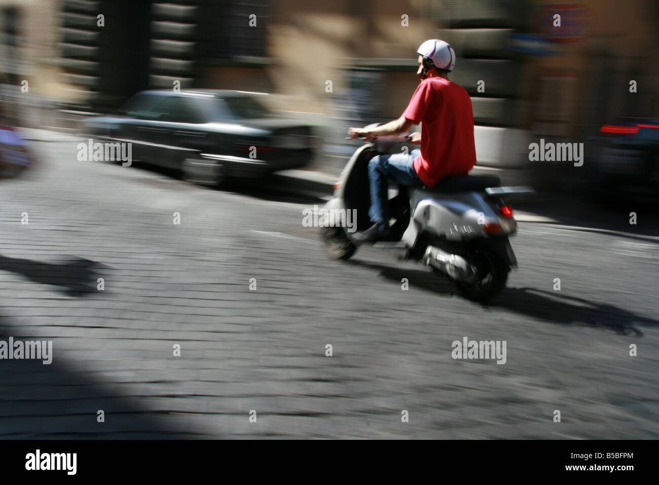 Man riding moped in rome hi-res stock photography and images - Alamy