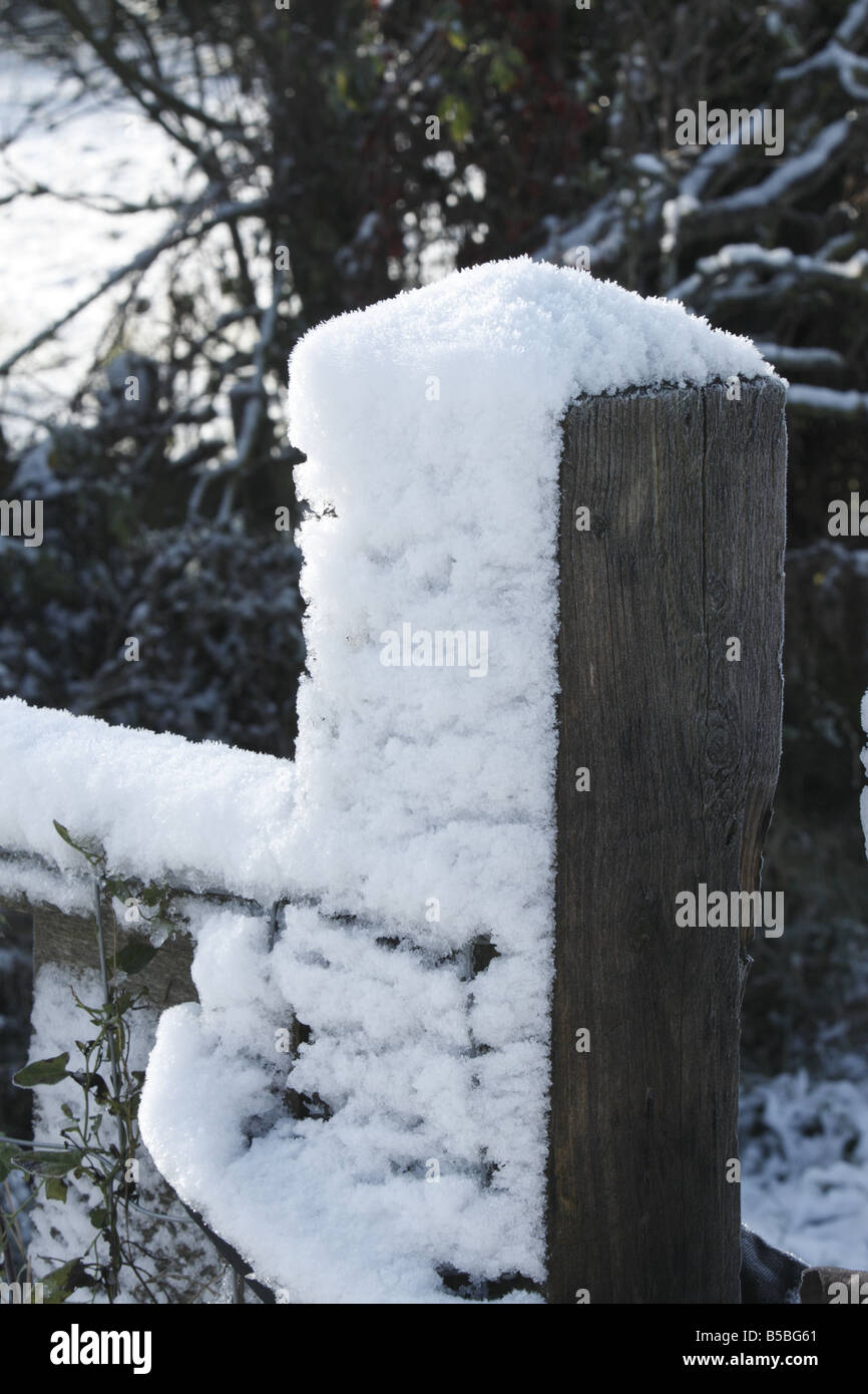 Gate post covered in snow Stock Photo - Alamy