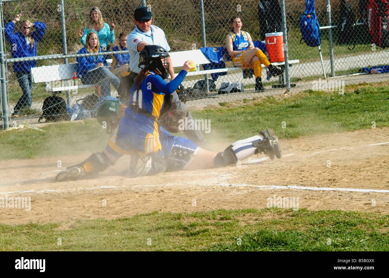 play at home plate in high school softball game Stock Photo - Alamy
