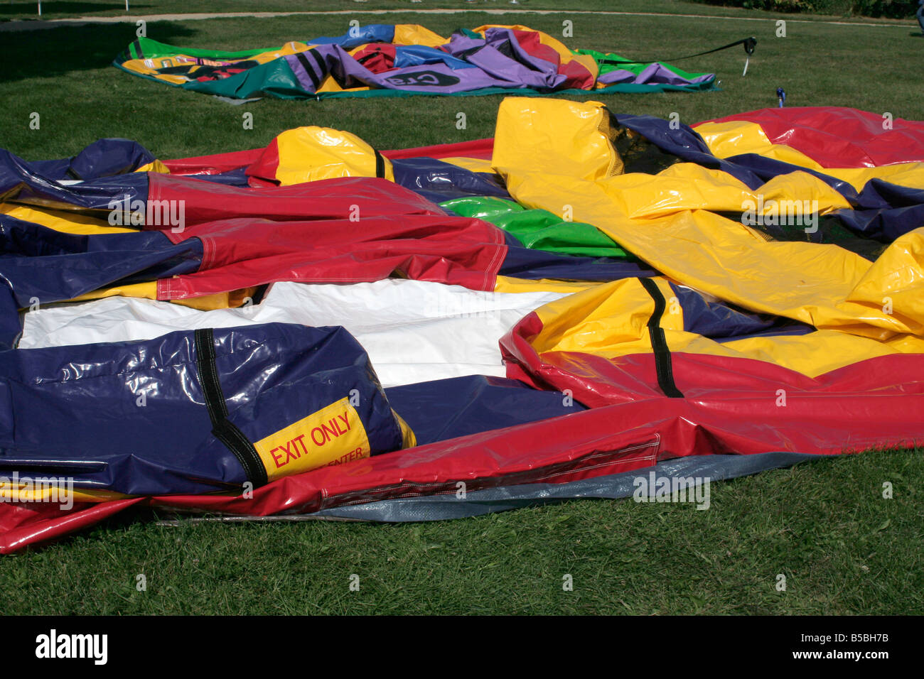 Deflated inflatable childrens bouncy castle at event Stock Photo - Alamy