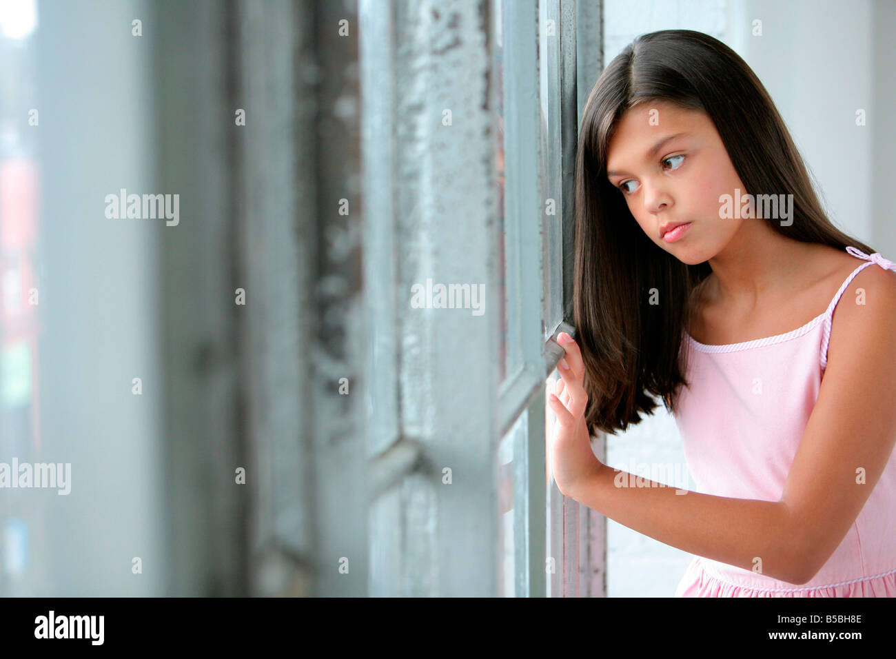 Girl looking contemplative Stock Photo - Alamy