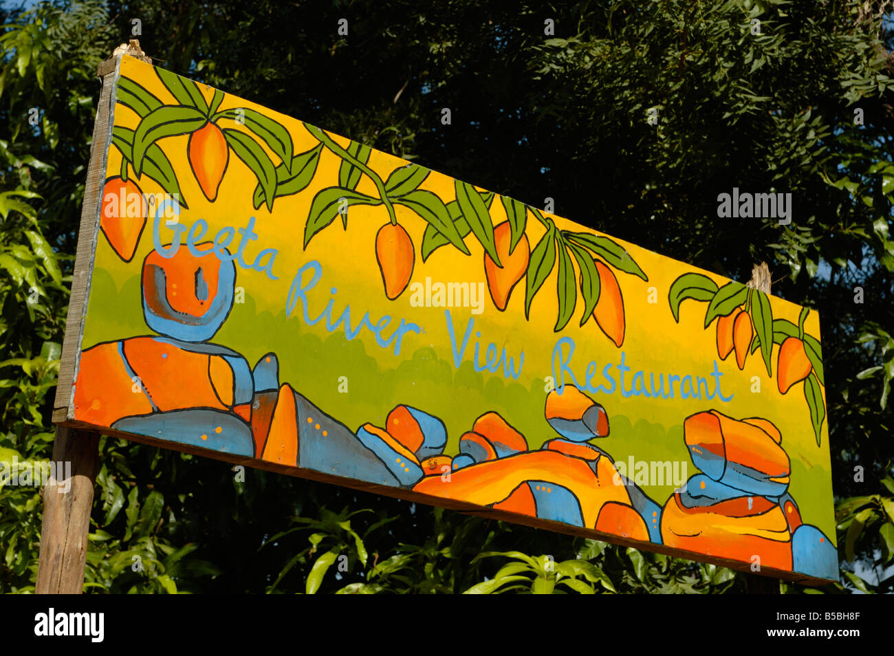 Colourful sign for Geeta River View Restaurant at the Tungabhadra River ...