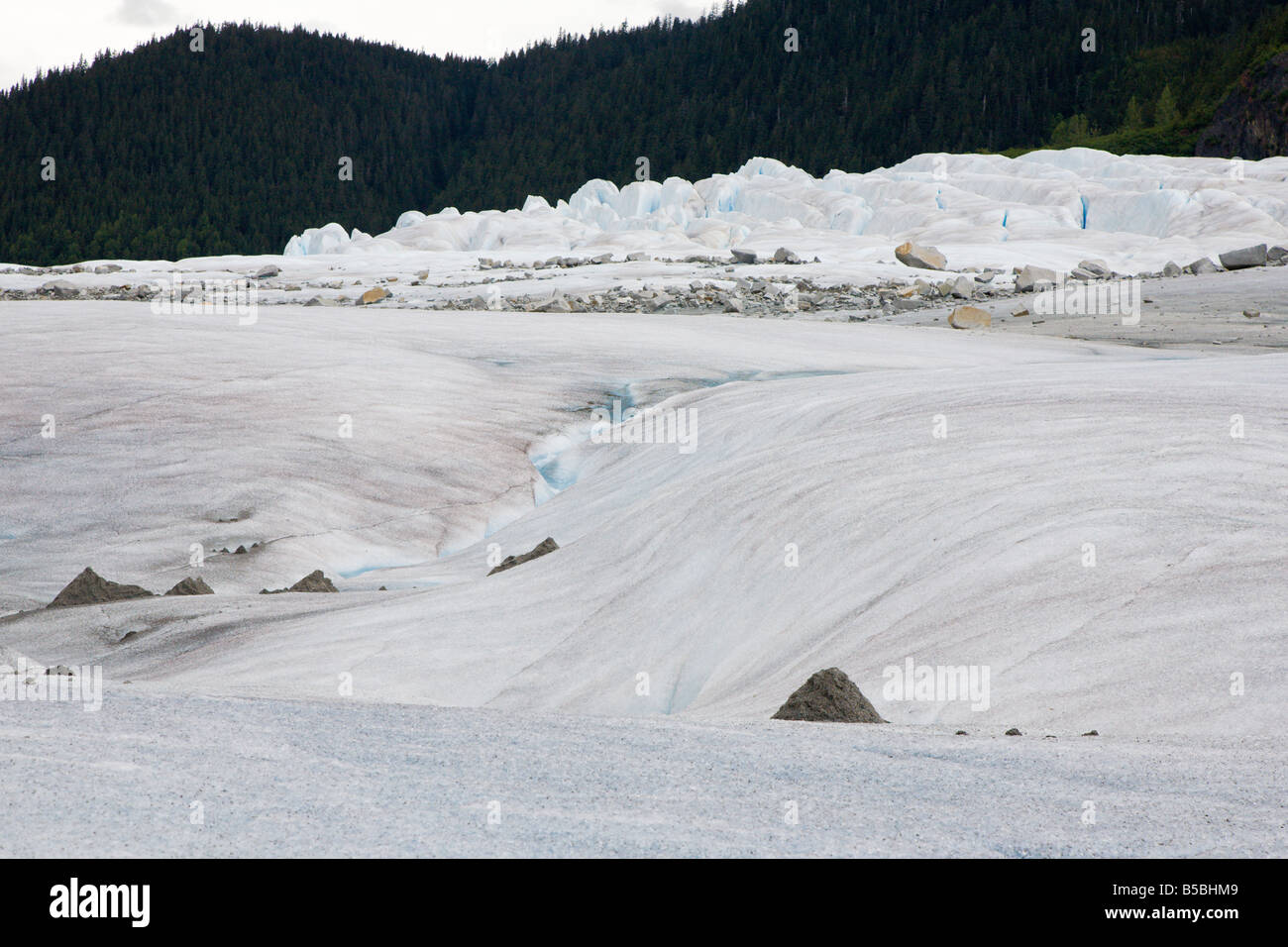 Mountain boulders litter the top of Mendenhall Glacier near Juneau ...