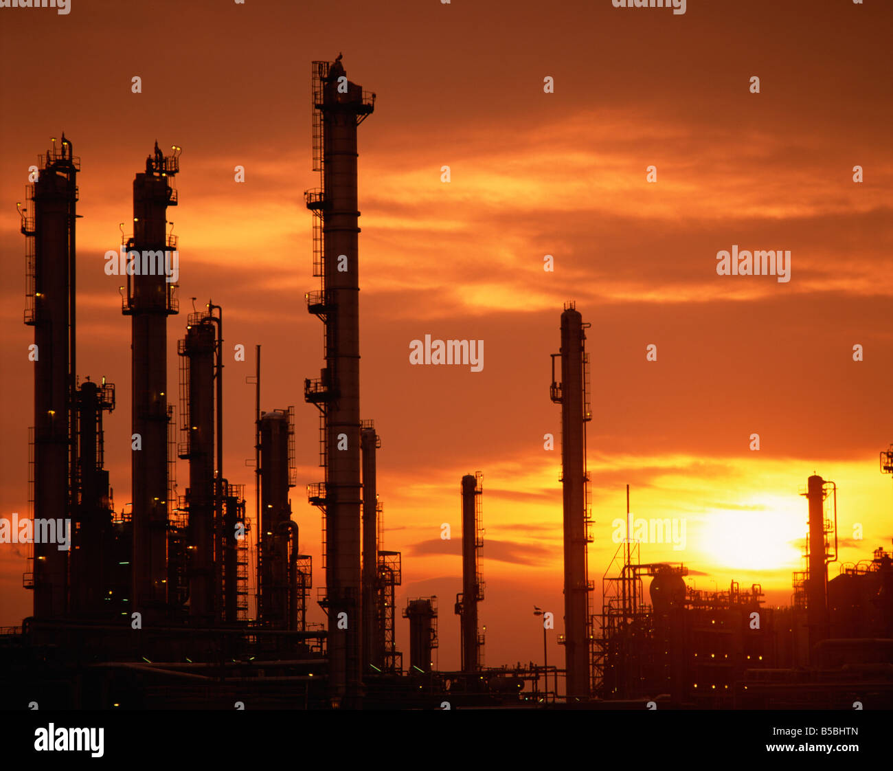 A petro chemical plant in South Wales silhouetted against the sunset ...
