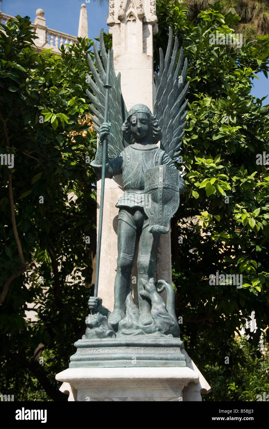 Bronze statue on the garden wall of Palacio de la Generalitat in the ...