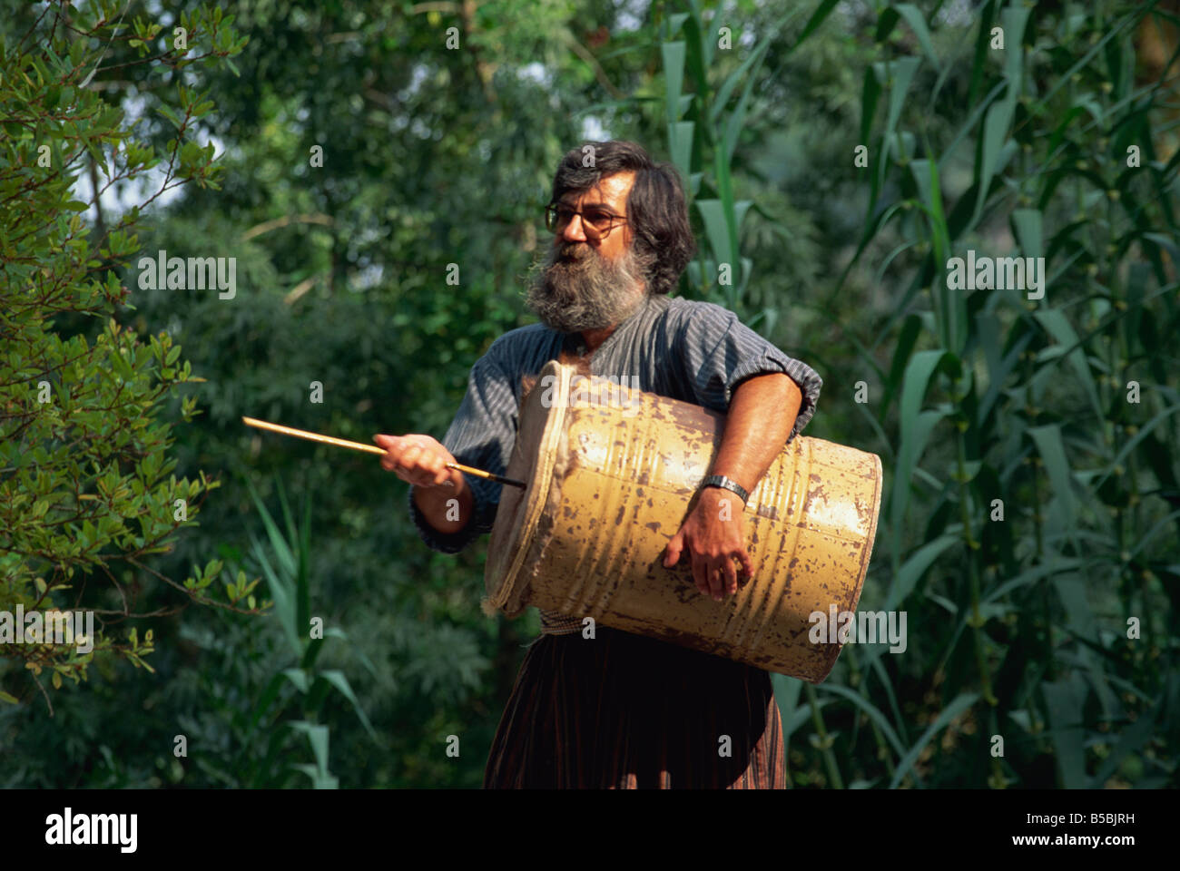 Traditional musician playing the zambomba, La Granja, Mallorca ...