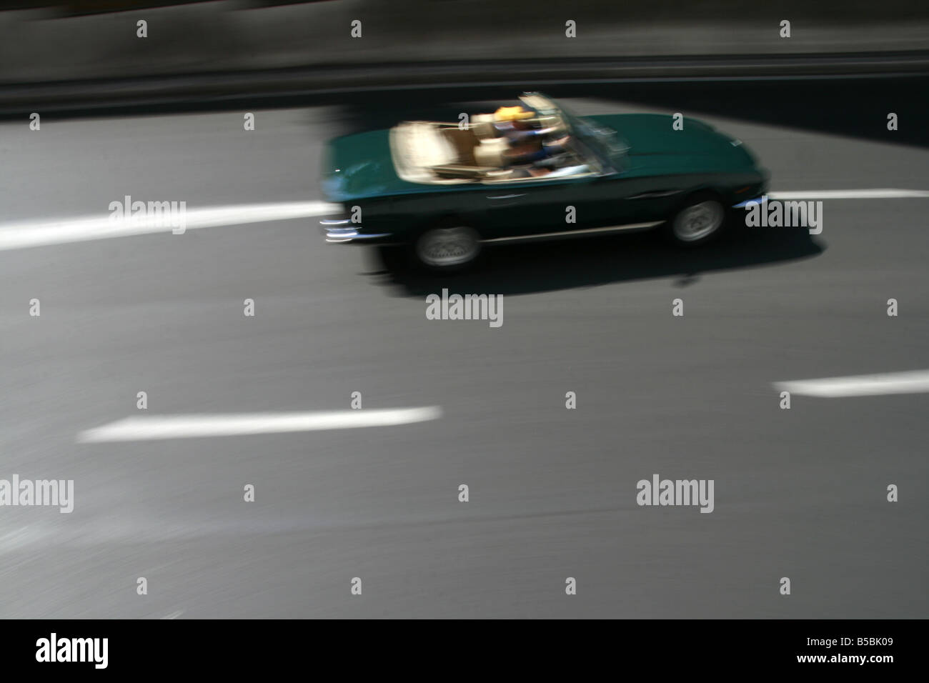 aerial view of fast sports car on open road Stock Photo - Alamy