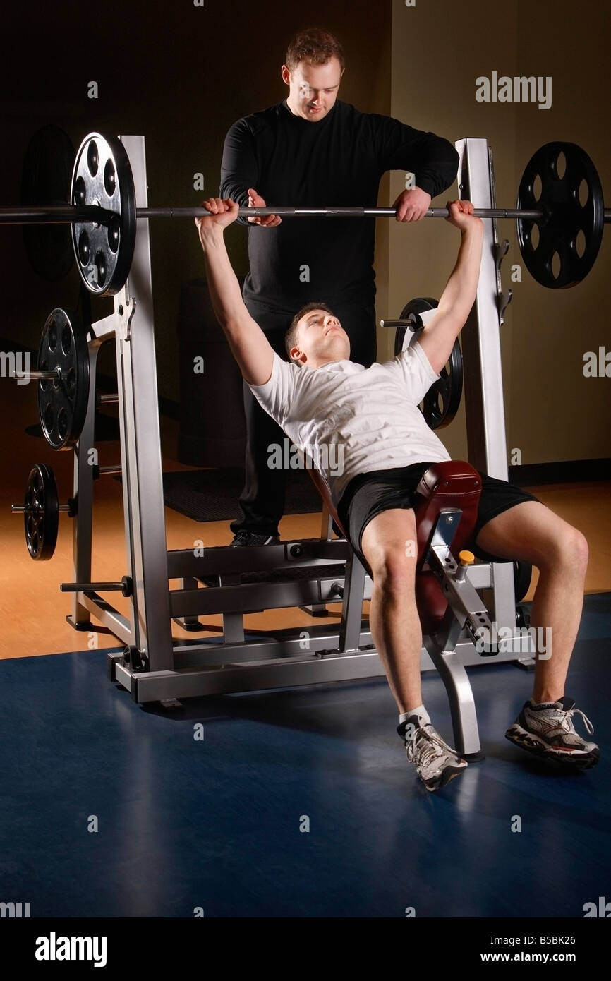 Man lifting weights Stock Photo - Alamy