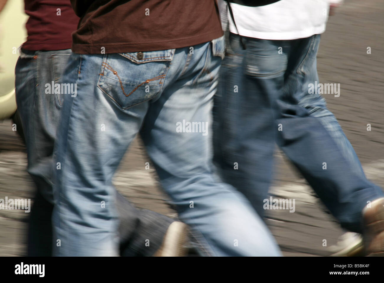 group young people in denim jeans walking in town Stock Photo - Alamy