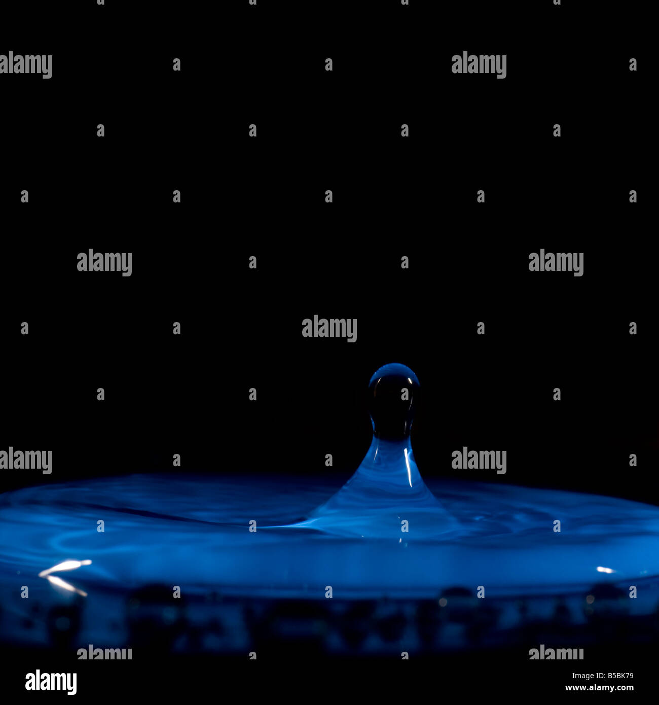 Water splash close-up. Drop of water. Blue water drop. Falling water ...