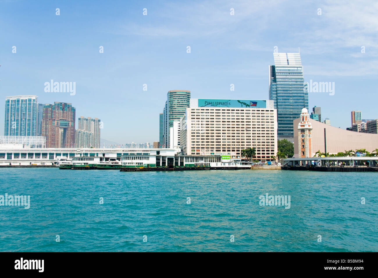 Star Ferry terminal with the clock tower , Victoria harbour, Kowloon ...