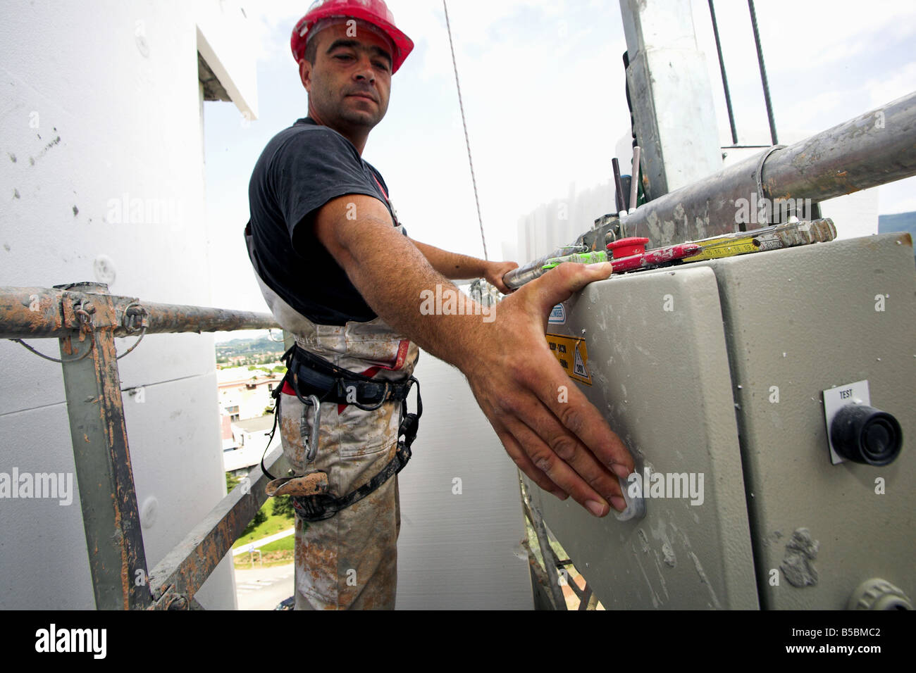 A worker on the manson elevator a.k.a. sky climber Stock Photo - Alamy