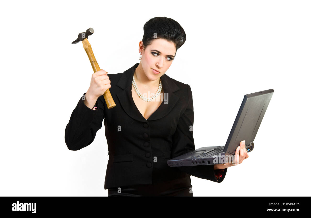 Woman hitting laptop computer hammer hi-res stock photography and ...