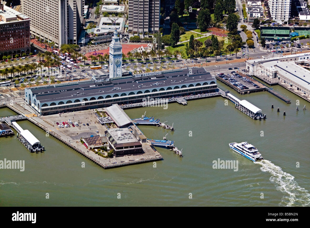 aerial view above ferries arriving at San Francisco ferry building ...