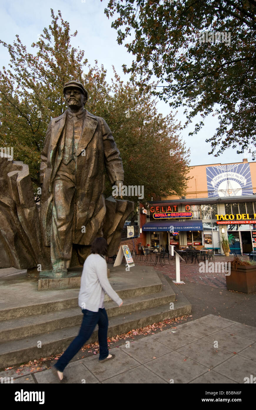 A woman walks in front of the statue of Vladimir Lenin in Seattle's ...