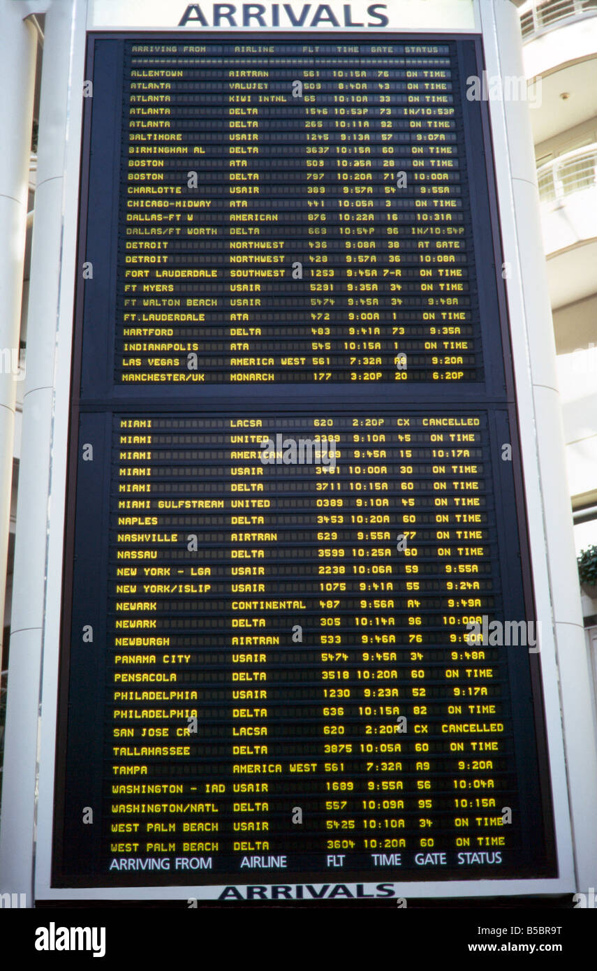 Airport arrival display showing flight times, Orlando International ...