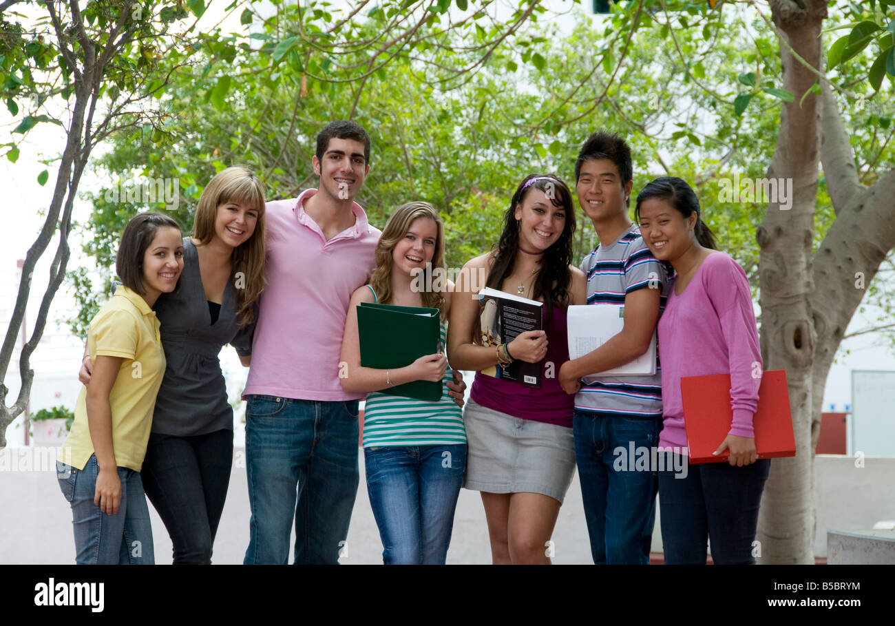 Group of happy attractive senior teenage school students relaxing and ...