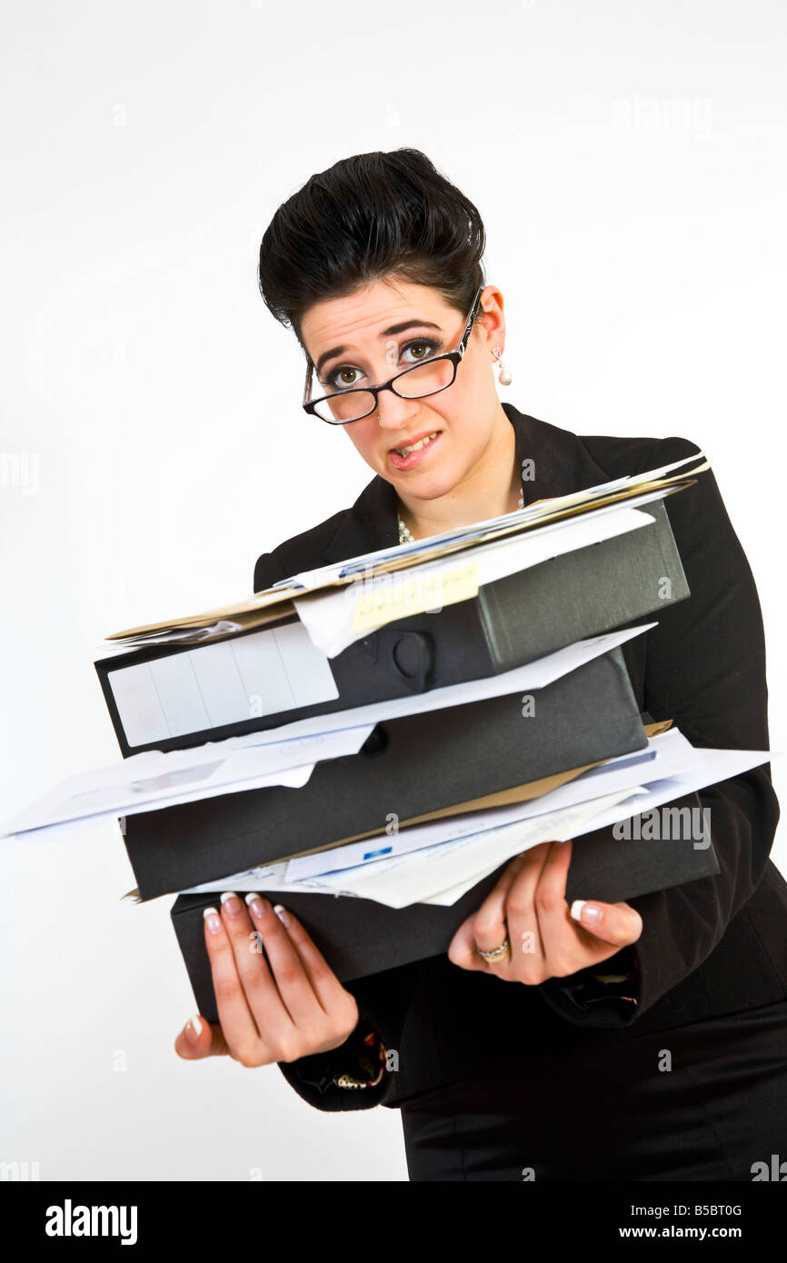 Business woman overwhelmed with work Stock Photo - Alamy