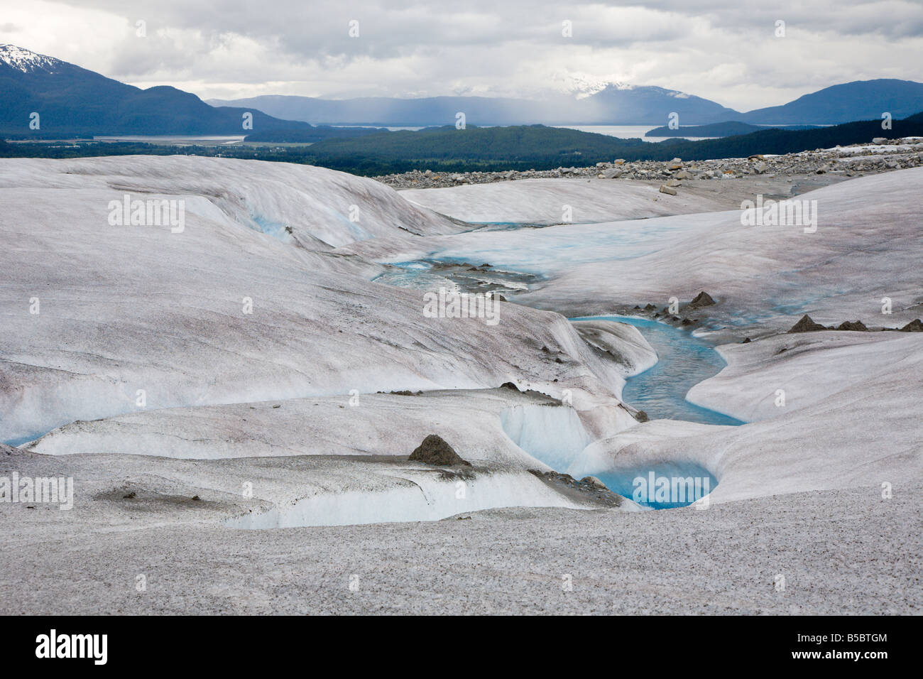 Melting ice carves streams into top of Mendenhall Glacier near Juneau ...