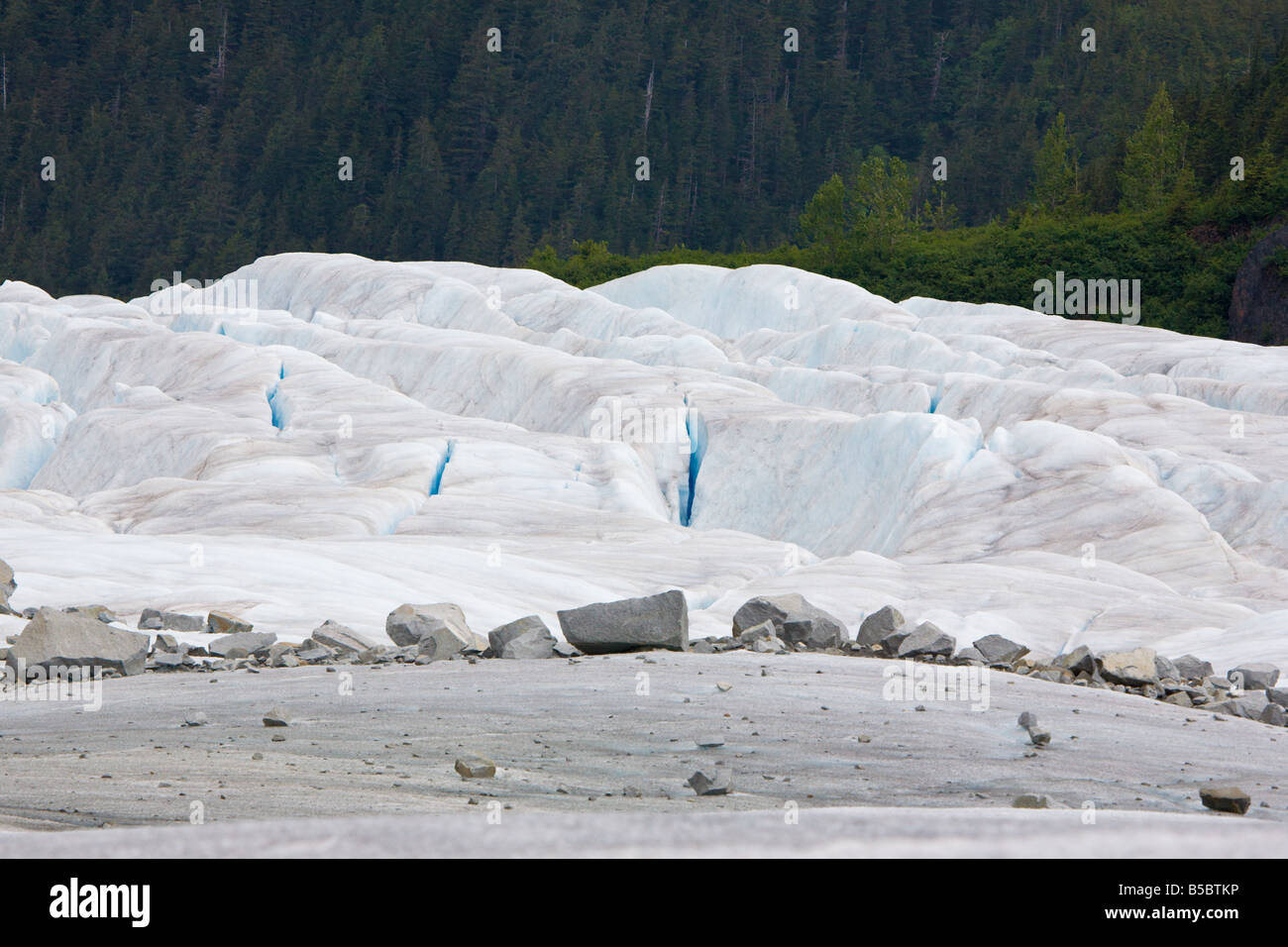 Mountain boulders litter the top of Mendenhall Glacier near Juneau ...
