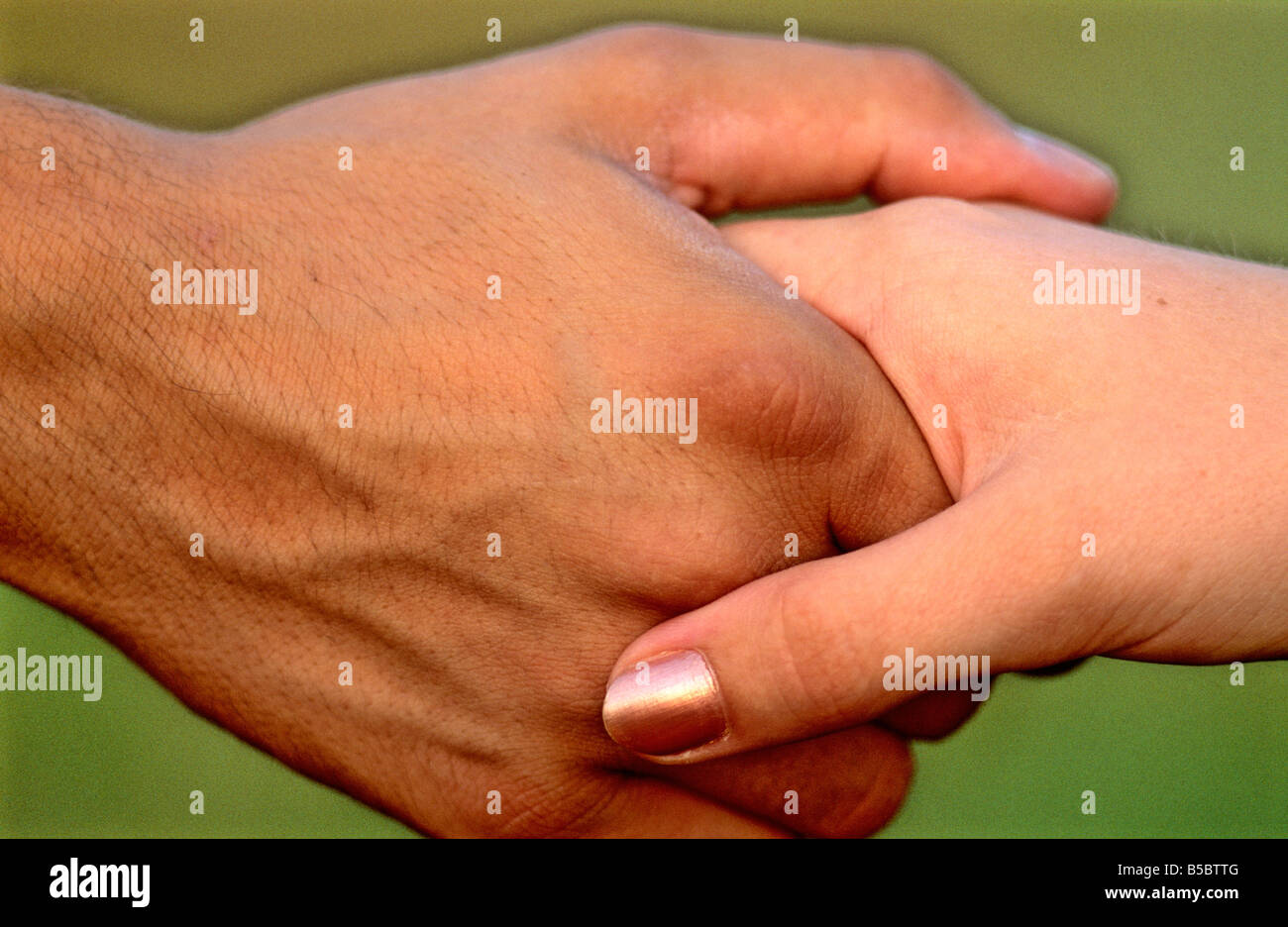 Man and woman shaking hands handshake Stock Photo - Alamy