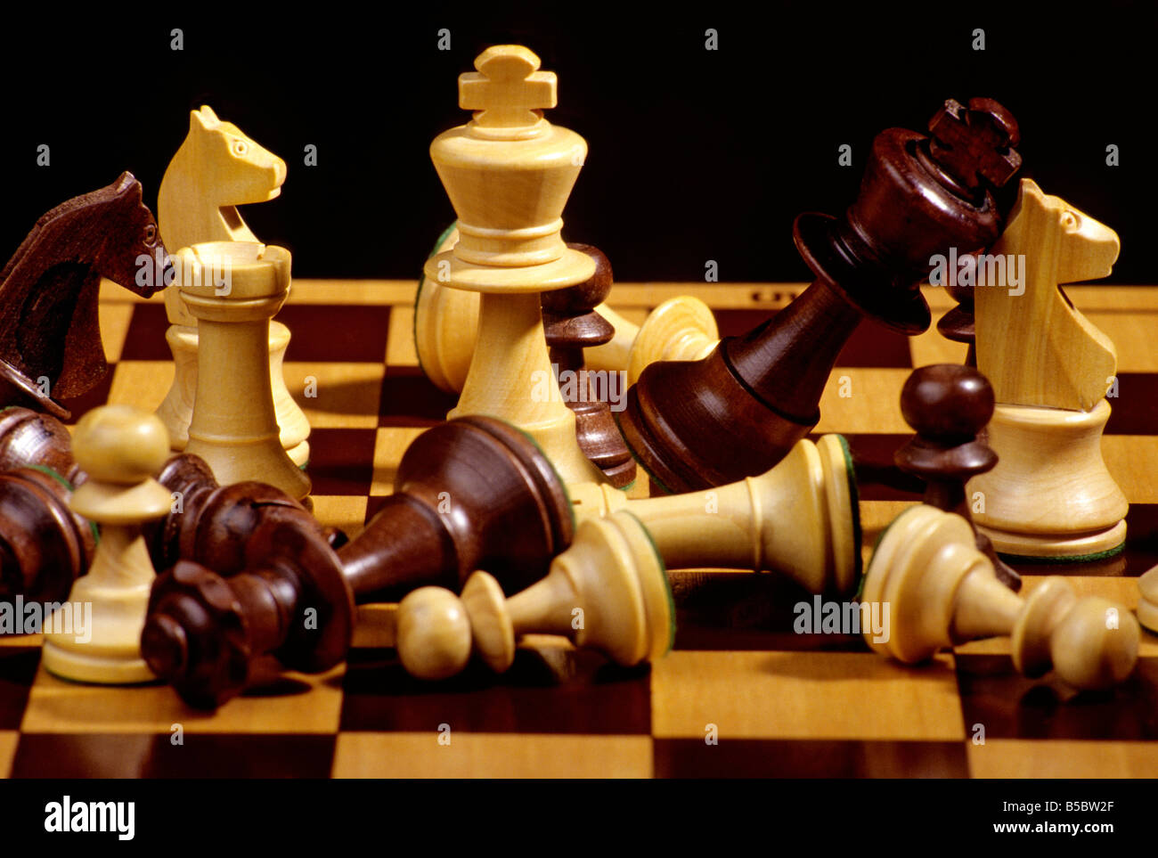 Chess game with the pieces lying at angles on the board Stock Photo - Alamy
