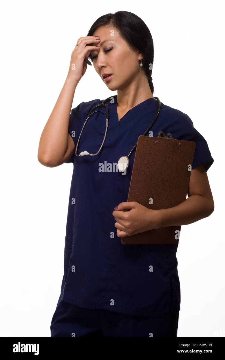 Nurse with a headache Stock Photo - Alamy