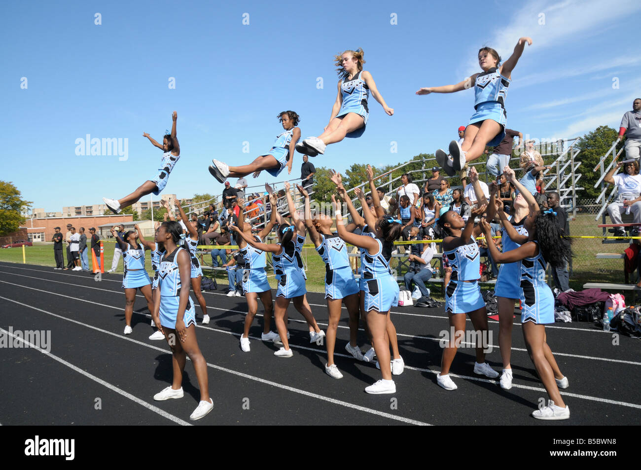cheerleaders perform during a high school football game in Maryland ...