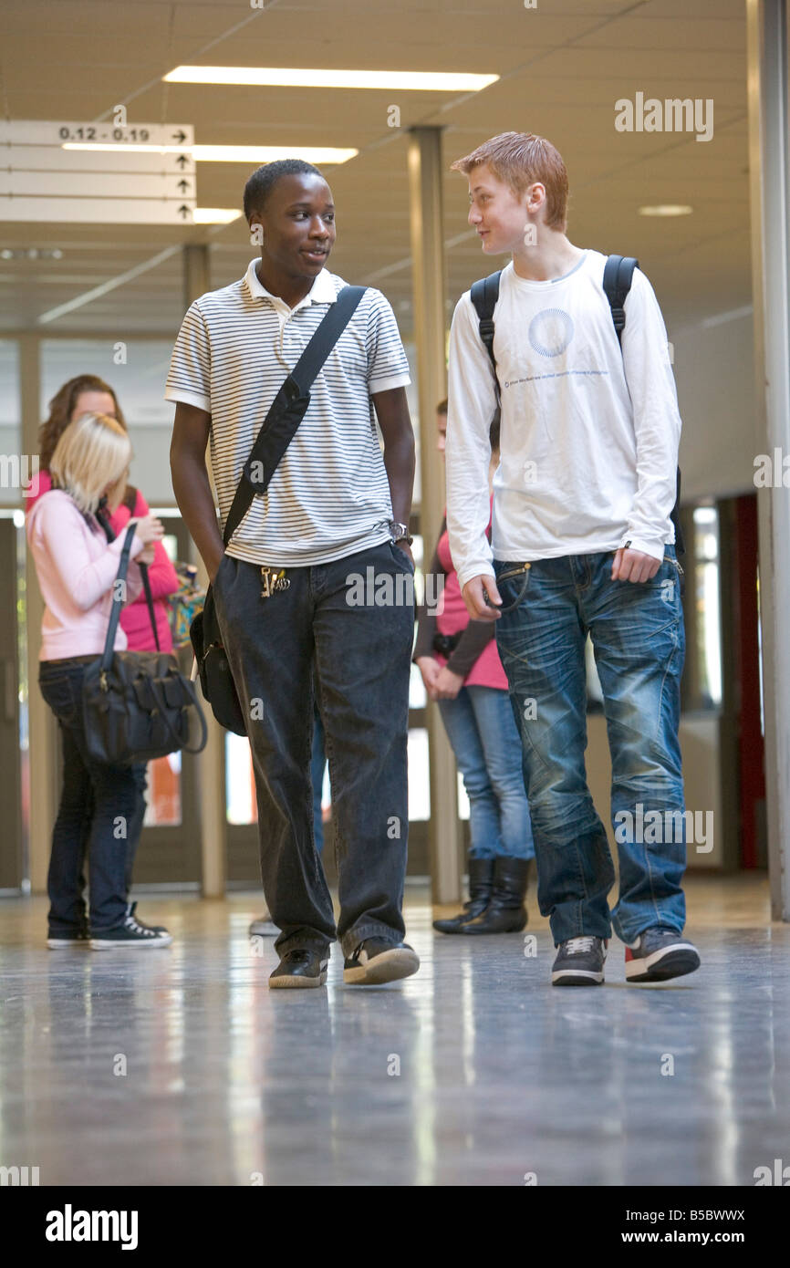 Teenage boys talking in the school hall Stock Photo - Alamy
